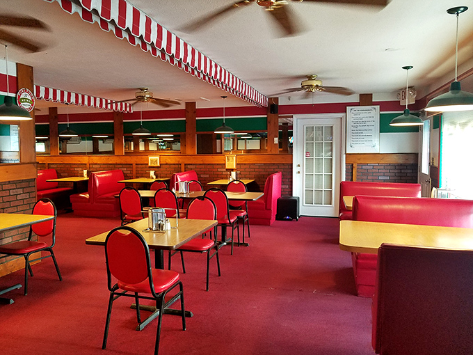 Step inside this retro wonderland where red booths and good vibes create the perfect pizza paradise.