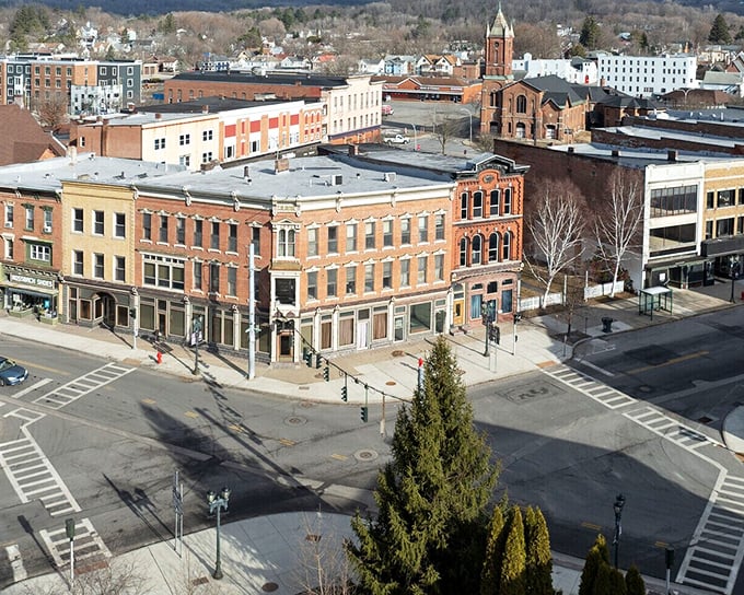 Gloversville's downtown panorama reveals a patchwork of historic buildings where city hall neighbors local shops in a living museum of affordable small-town America.