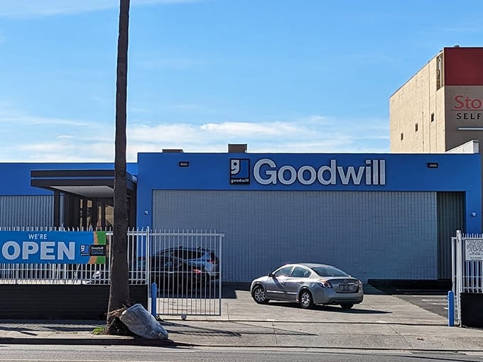 The blue fortress of Goodwill Southern California, where one person's castoffs become another's treasures. Open gates welcome donation drop-offs.