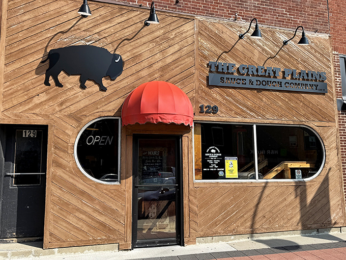 That red awning and buffalo logo signal you've found pizza territory worth exploring. Great Plains doesn't just serve pizza&mdash;it serves an experience.
