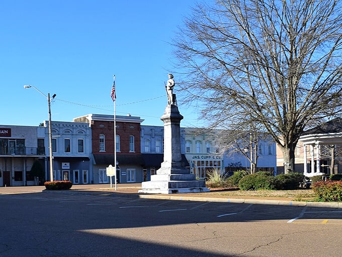 The town square in Grenada showcases a historic monument surrounded by affordable shops and businesses perfect for retirement living.