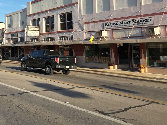 The town spreads beneath its iconic water tower, tucked among trees that have shaded generations.
