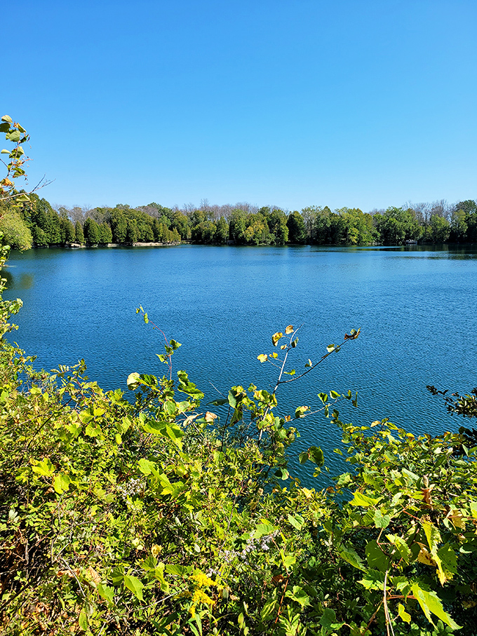 Mirror-like waters reflect the surrounding forest, creating a double dose of Wisconsin's natural beauty.