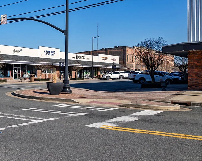 Downtown Jesup, where historic buildings house modern bargains. The red truck isn't rushing anywhere&mdash;life moves at an affordable pace here.