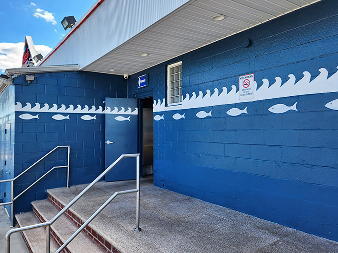 That blue building by the water knows one truth: great seafood doesn't need fancy walls, just fresh ingredients.