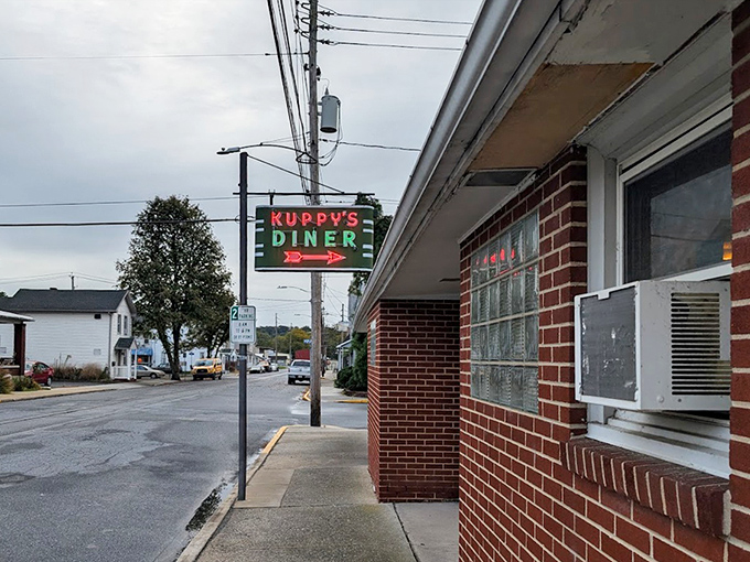 That modest sign hides big flavors—Kuppy's Diner proves the best food often comes from the most unassuming places.