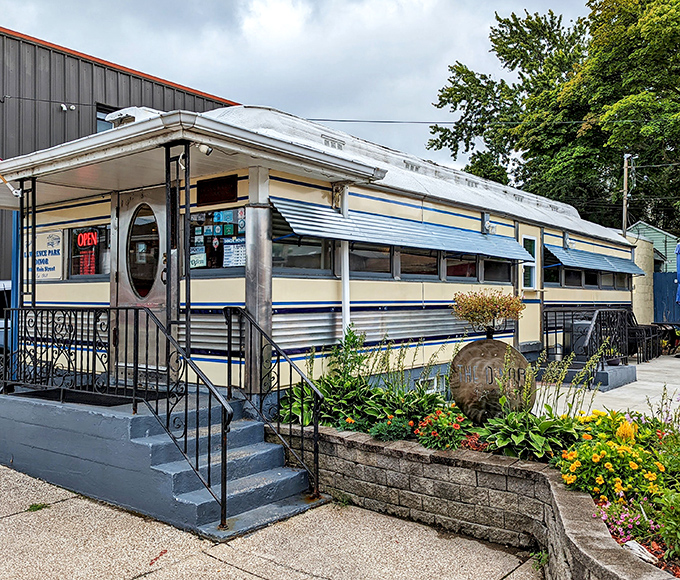 Blue and cream stripes wrap this compact railcar diner &ndash; small in size but mighty in flavor and local charm.