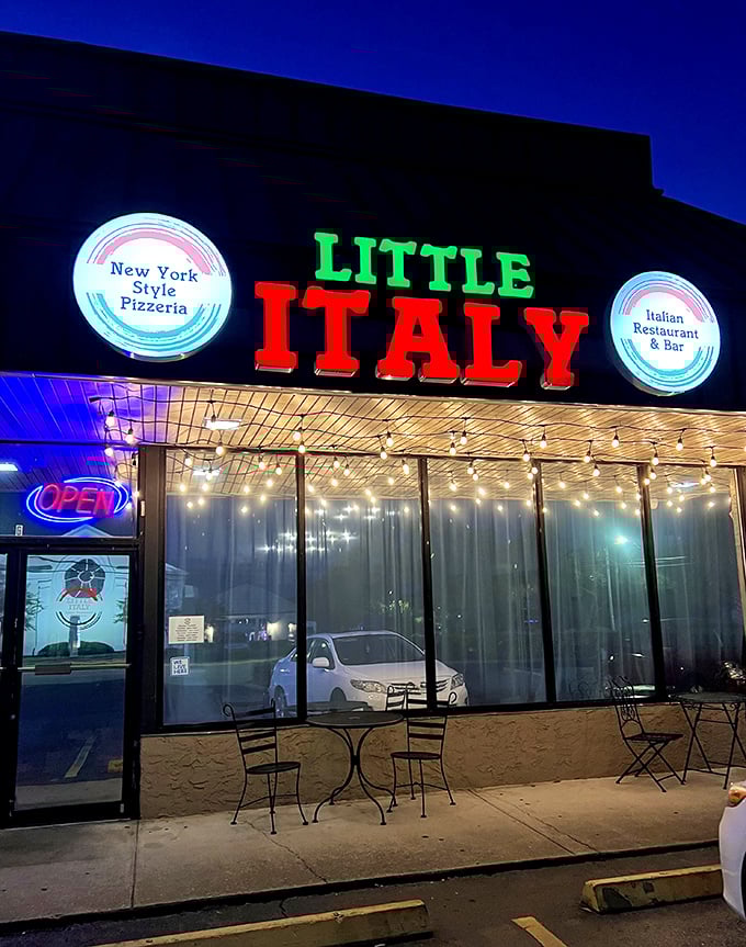By night, Little Italy transforms into a glowing pizza oasis that practically whispers "mangia, mangia!"