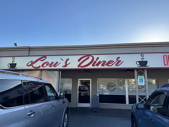 Morning salvation in neon red! Lou's Diner stands ready to rescue hungry souls with omelets that could feed a small country.