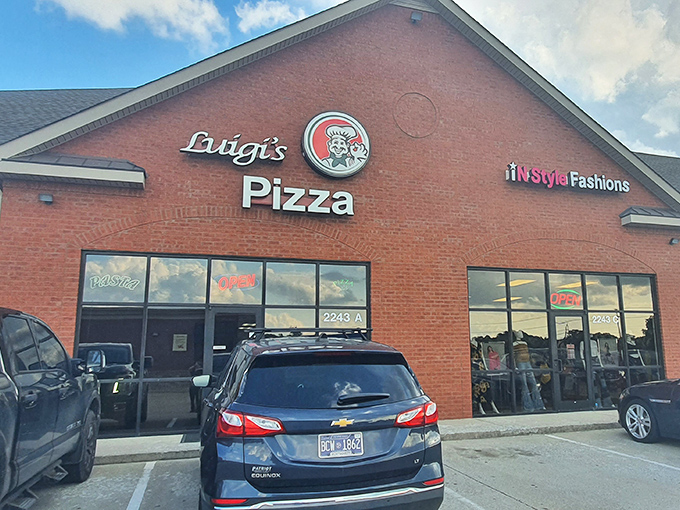 Luigi's Pizza shares its strip mall home with a fashion boutique, proving great pizza can be found in the most unexpected places.