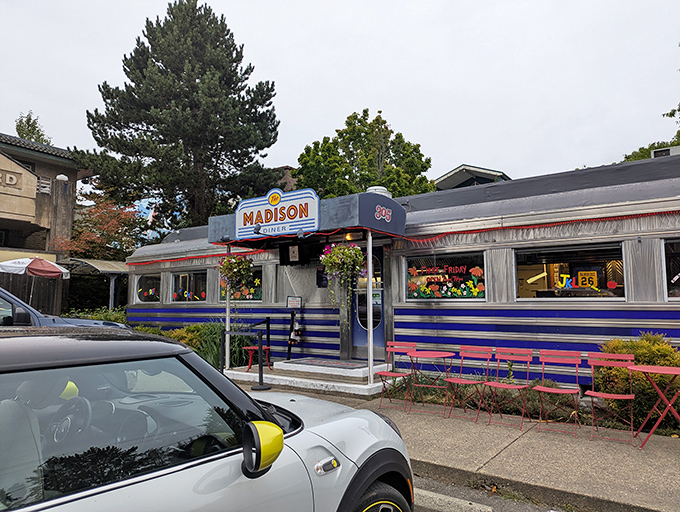 Nothing says "authentic diner experience" quite like that shiny exterior and those welcoming blue umbrellas outside.
