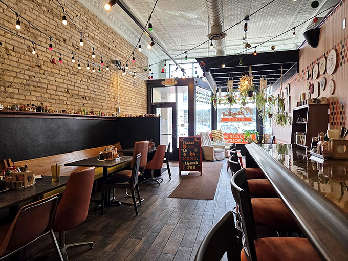 Inside Marge's, exposed brick and string lights create the perfect backdrop for comfort food that's been upgraded without losing its soul.