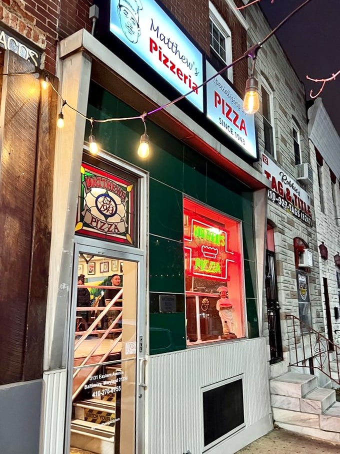 Matthew's glowing sign cuts through the night like a pizza bat-signal, summoning the hungry and faithful. 