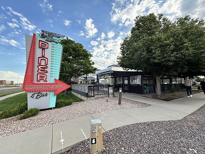 That sign could guide astronauts home! The Moonlight's retro-futuristic neon glow is Denver's answer to the Bat-Signal for hungry night owls.