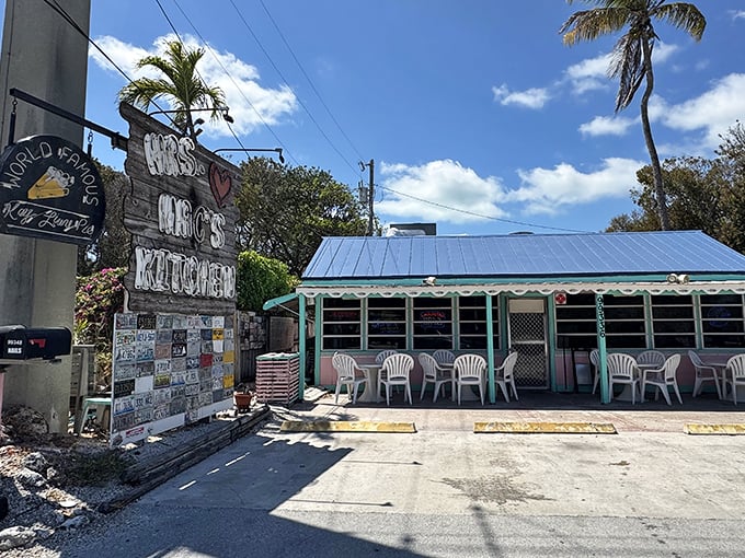 Mrs. Mac's Kitchen in Key Largo welcomes hungry travelers with its rustic sign and breezy outdoor seating under the Florida sun.