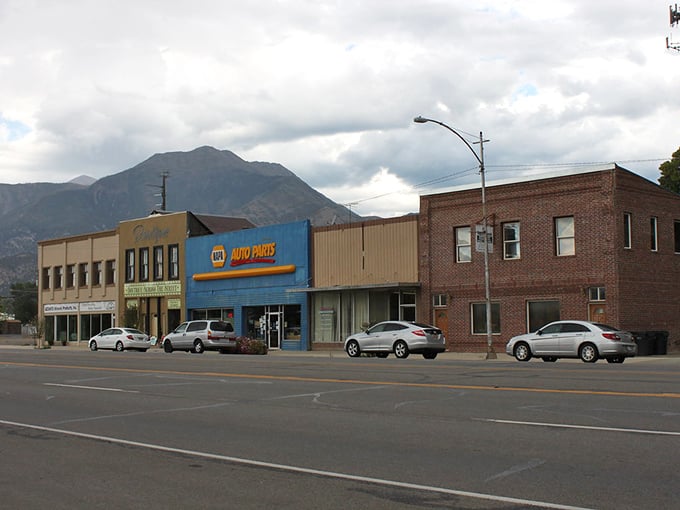 Old brick buildings line Nephi's downtown, where local businesses have served generations. The Coca-Cola mural adds a splash of nostalgic color.