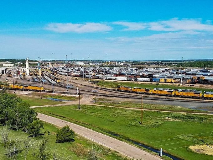 Nebraska farmland beauty captured in one frame: a bird&rsquo;s-eye view of endless green fields beneath a wide, blue sky.