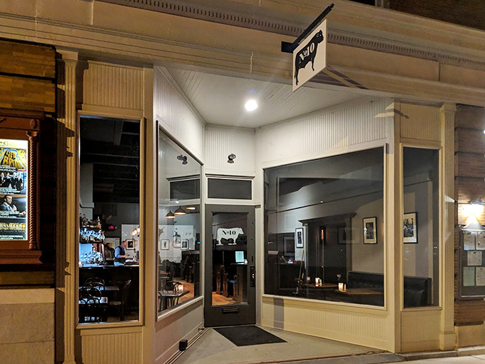 By night, this unassuming storefront transforms into a cozy steak sanctuary. Great things come in modest packages!