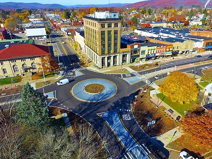 Fall leaves frame this quaint Olean street, proving that sometimes the best shopping experiences don't require a platinum card.