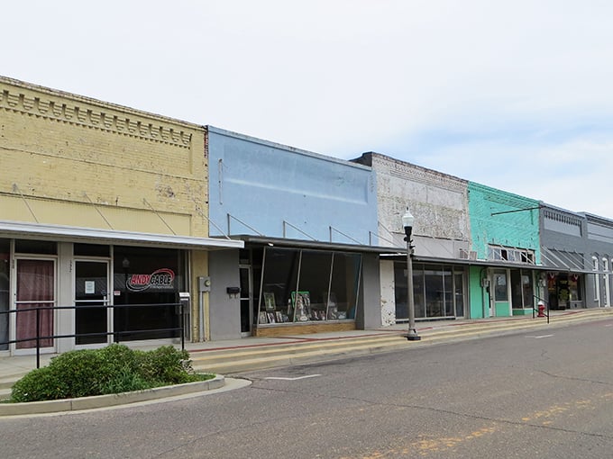 Historic brick buildings line Opp's main street, showcasing the town's architectural heritage that dates back generations.