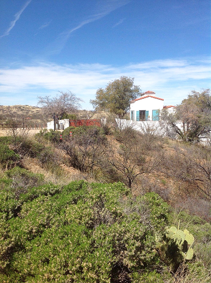 White-walled buildings nestle into rolling hills like hidden treasures waiting to share their environmental education secrets.
