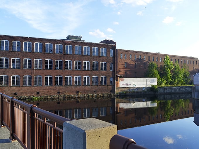 A peaceful bridge crossing in Orange where the water reflects the town's history and American flags stand proud without breaking your budget.
