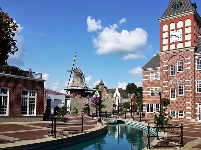The windmill stands sentinel over Pella's canal like a postcard from the Netherlands that somehow landed in Iowa.