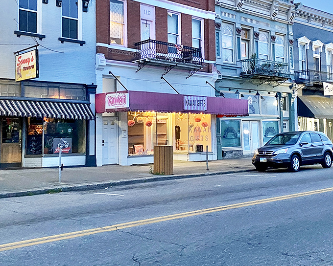 Evening settles on Pomeroy's main street, where glowing shop windows invite exploration and the promise of local treasures.