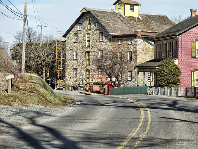 In Ronks, even the transportation comes with a side of charm. This buggy passes a traditional brick farmhouse.