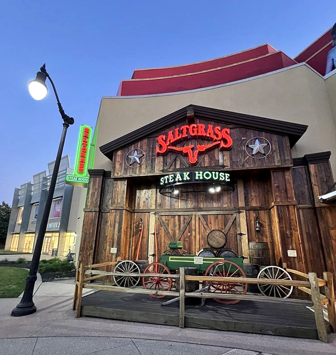 As dusk falls, Saltgrass's neon sign glows like a beacon for hungry travelers. The Texas-sized portions inside won't disappoint.