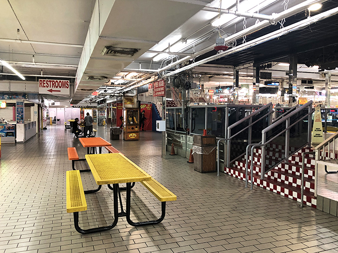 Food court break! These cheerful yellow benches offer the perfect pit stop when your shopping legs need a rest and your stomach needs attention.