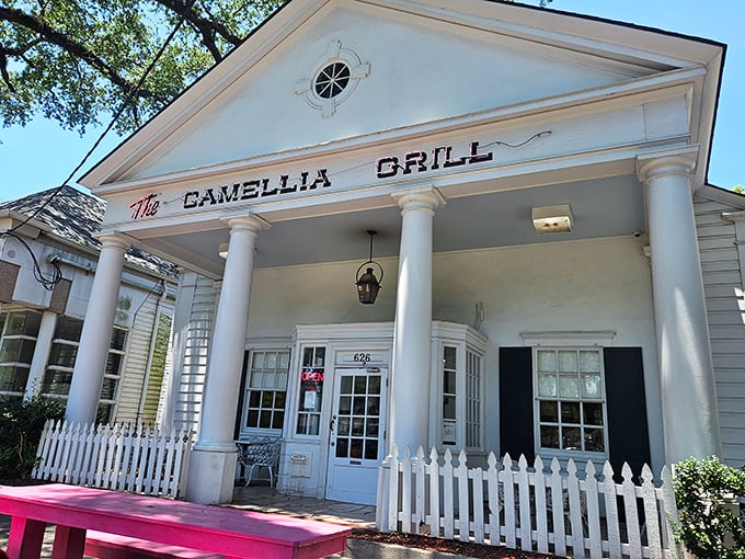 A temple to good eating! The Camellia's classic architecture and white picket fence promise Southern hospitality before you even step inside.