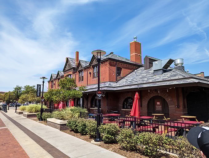 Imagine enjoying a perfect slice where travelers once waited for trains. This architectural gem serves up history with a side of pepperoni.