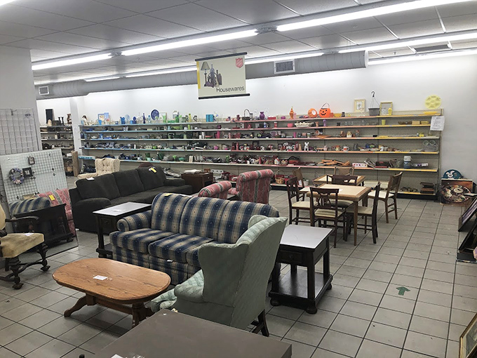 Couch potato paradise! The Salvation Army's furniture section showcases secondhand sofas and colorful housewares that whisper, "Take me home!"