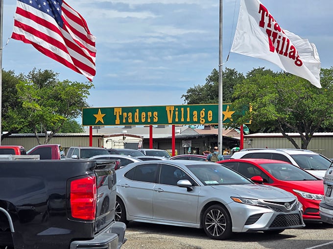 Stars, stripes, and shopping delights! Traders Village Grand Prairie flies its flags proudly above a sea of parked cars.