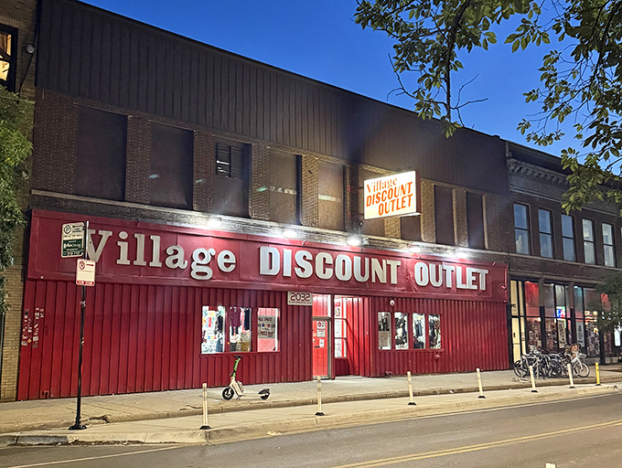 As night falls, Village Discount glows like a beacon for night owls hunting vintage treasures and unexpected finds.