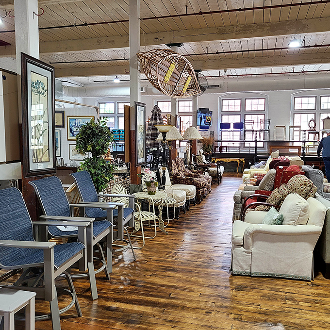 Outdoor furniture mingles with indoor treasures while a wicker canoe hangs overhead &ndash; like a design magazine spread come gloriously to life.