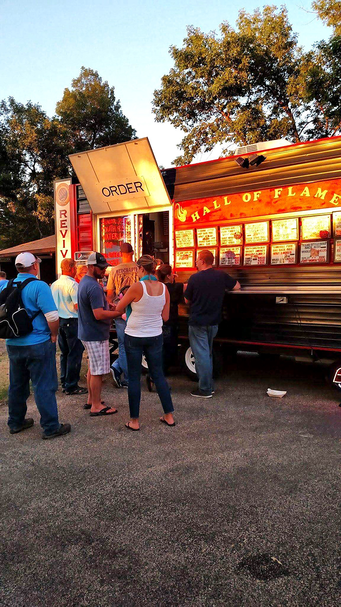 At the "Hall of Flame" food truck, locals line up for ribs that make social distancing a challenge worth accepting.