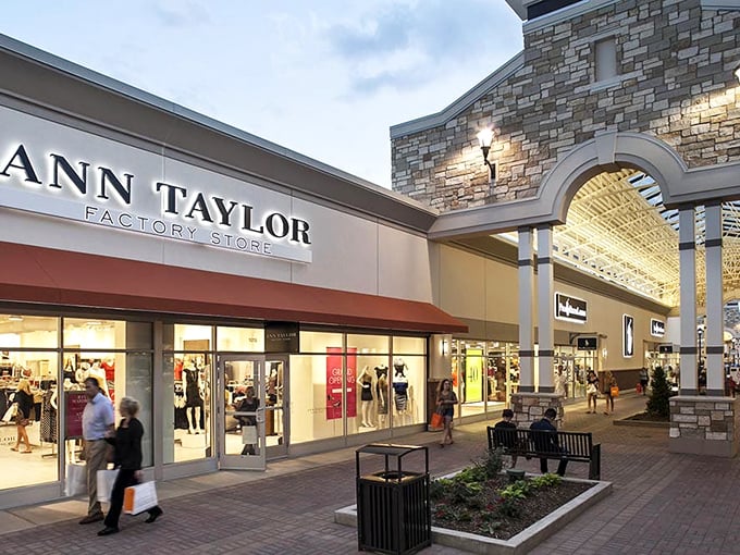 Ann Taylor Factory Store welcomes evening shoppers with that warm retail glow that whispers, "Just one more blouse won't hurt."