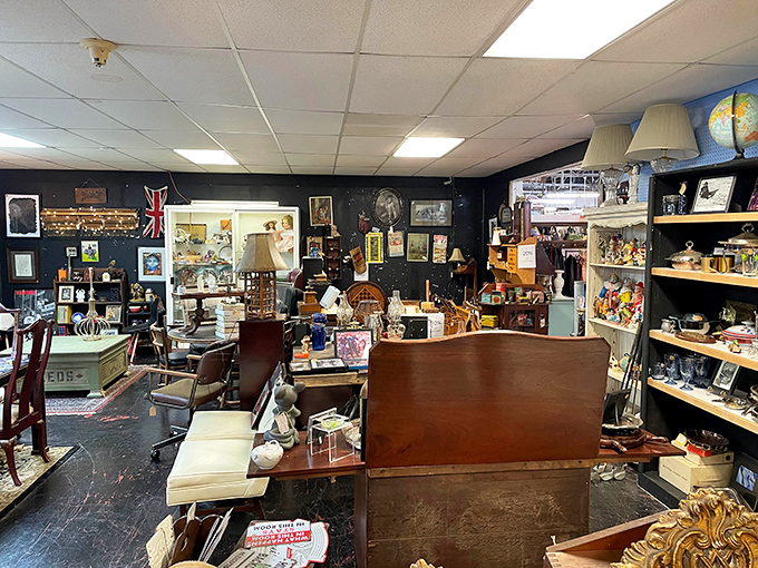 Where treasures hide in plain sight &ndash; this booth's dark walls create the perfect backdrop for displaying everything from Union Jacks to vintage globes.