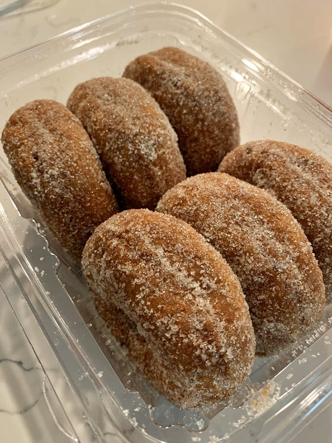 These aren't just donuts; they're cinnamon-sugar coated portals to a simpler, more delicious dimension of existence.