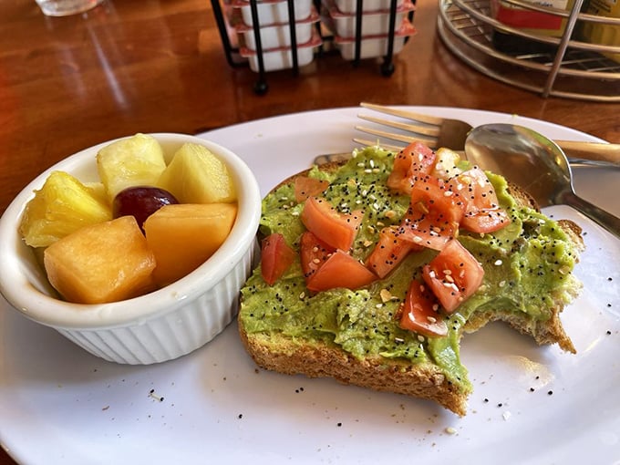 The avocado toast arrives like edible artwork&mdash;creamy green canvas, bright tomato confetti, and a side of fruit that makes you feel virtuous about your choices.
