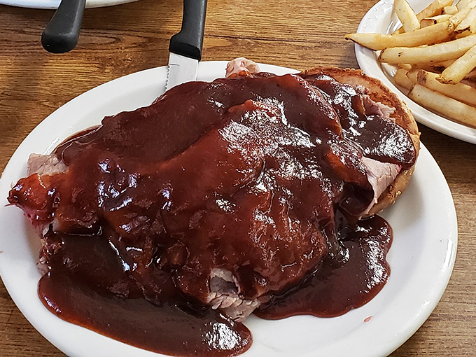 Behold the crown jewel: BBQ beef so tender it practically surrenders to your fork, swimming in a sauce worth bottling and hoarding.