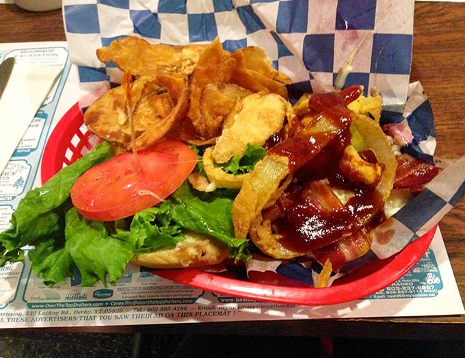 This isn't just a sandwich&mdash;it's architecture. Crispy onion rings and BBQ sauce create a tower of flavor that demands both hands and extra napkins.