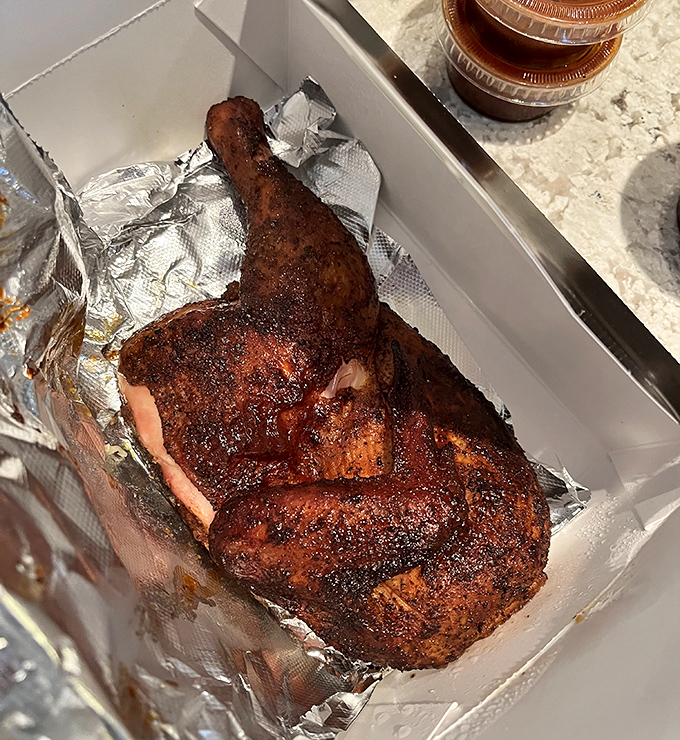 That bark! That smoke ring! This chicken has clearly graduated from the Harvard of hickory smoking with highest honors.
