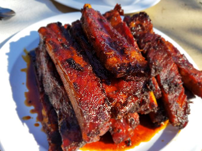These ribs don't just fall off the bone&mdash;they practically leap into your mouth, glistening with a perfect lacquer of smoke-kissed sauce.