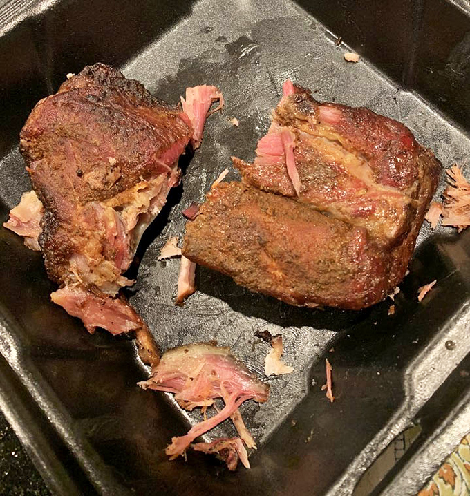 Baby back ribs so tender they're practically falling off the bone before you even pick up your fork, proving gravity works differently here.