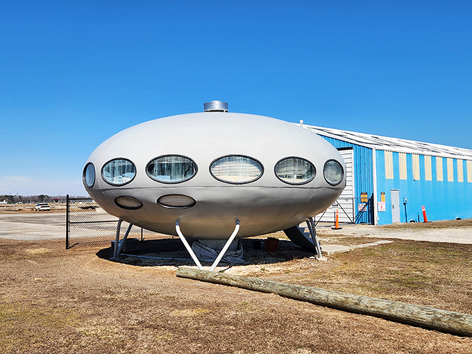 The Futuro's distinctive porthole windows circle the structure like a belt of eyes, constantly surveying the runway for fellow space travelers.