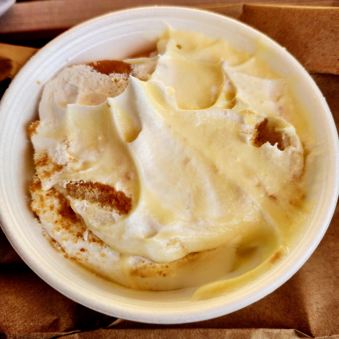 This banana pudding isn't just dessert; it's a creamy, dreamy time machine to childhood summers, where vanilla wafers dissolve into custardy bliss. 