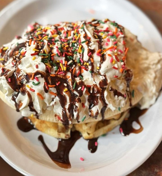 Dessert for breakfast? This mountain of whipped cream, chocolate, sprinkles, and waffle makes a compelling argument for starting your day with joy.